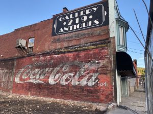 An antique ad uncovered on store that sells antiques - The Bradford Era